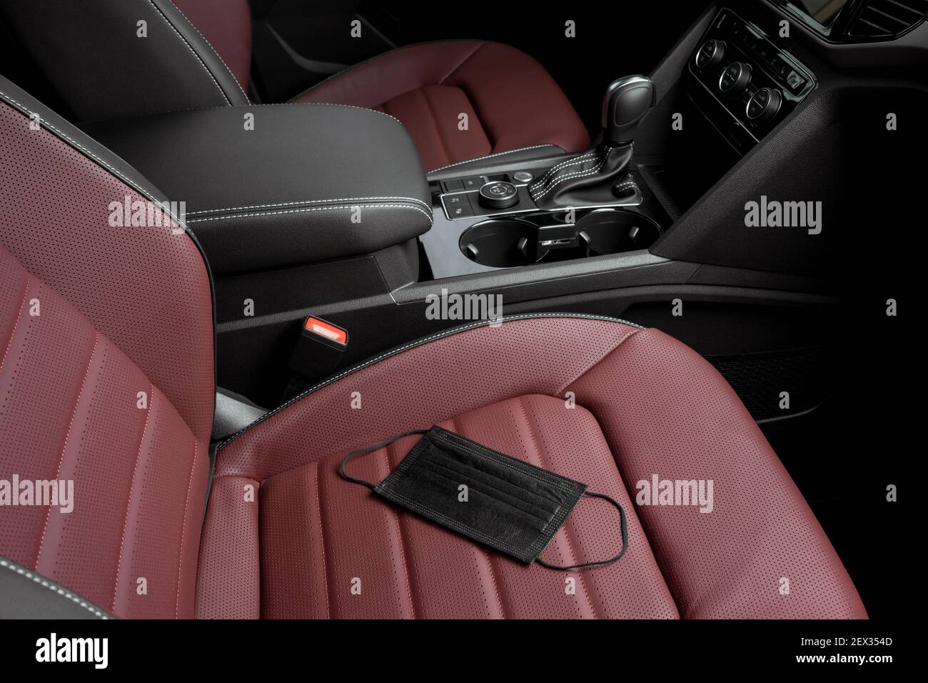 A closeup shot of a mask on the seat of a car Stock Photo - Alamy