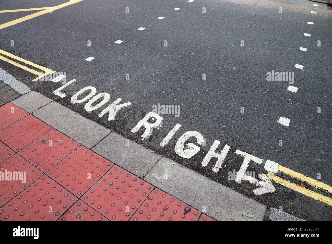 London pedestrian sign - look right at a pedestrian crossing. Traffic ...