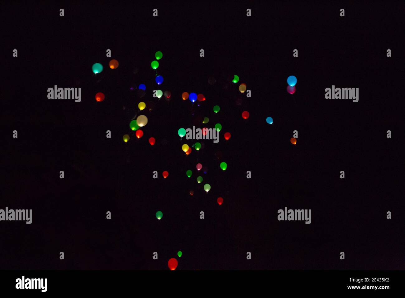 Colorful, glowing Balloons Flying in the Dark Night Sky Stock Photo - Alamy