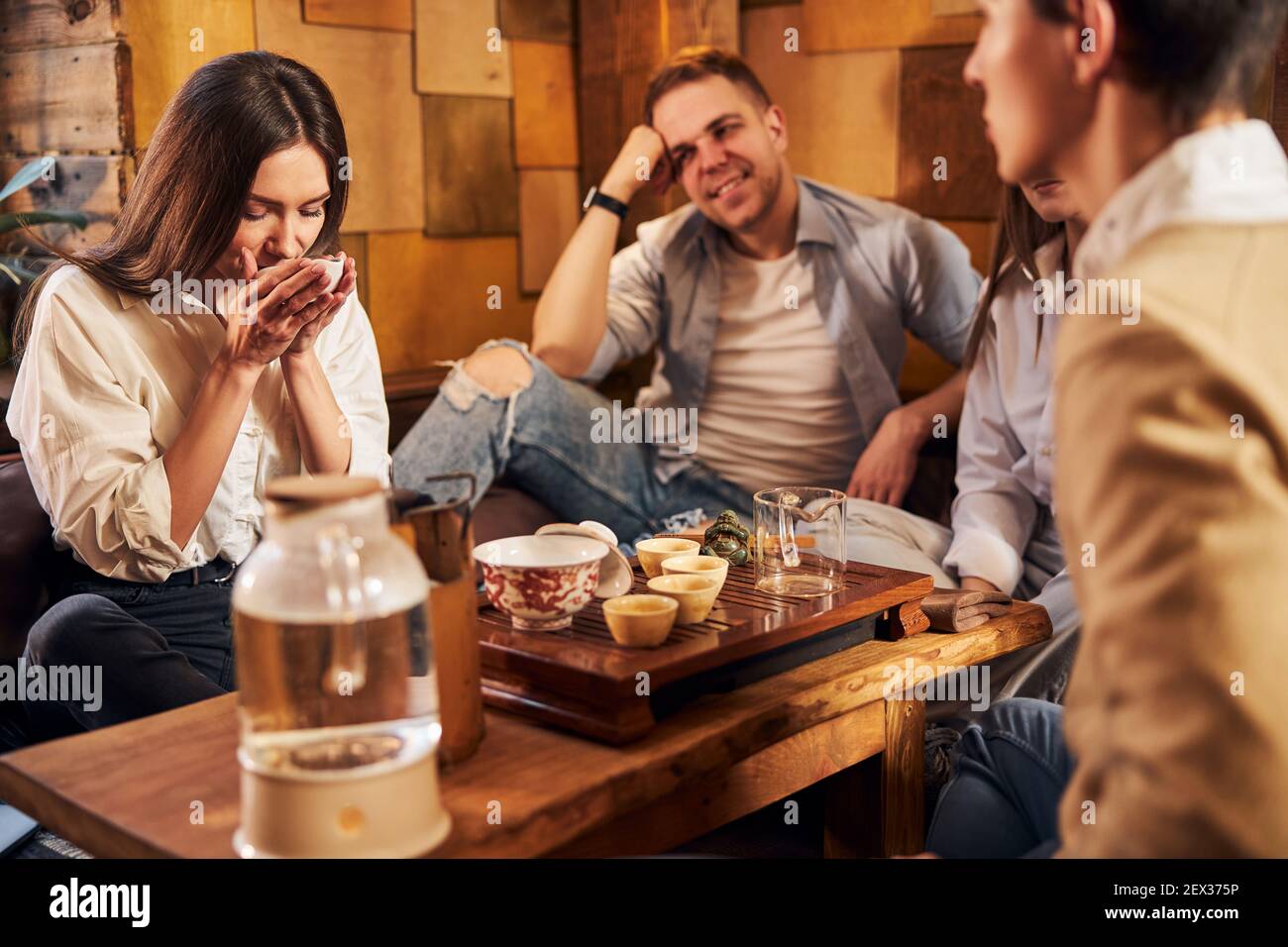 Young male female enjoying tea hi-res stock photography and images - Alamy