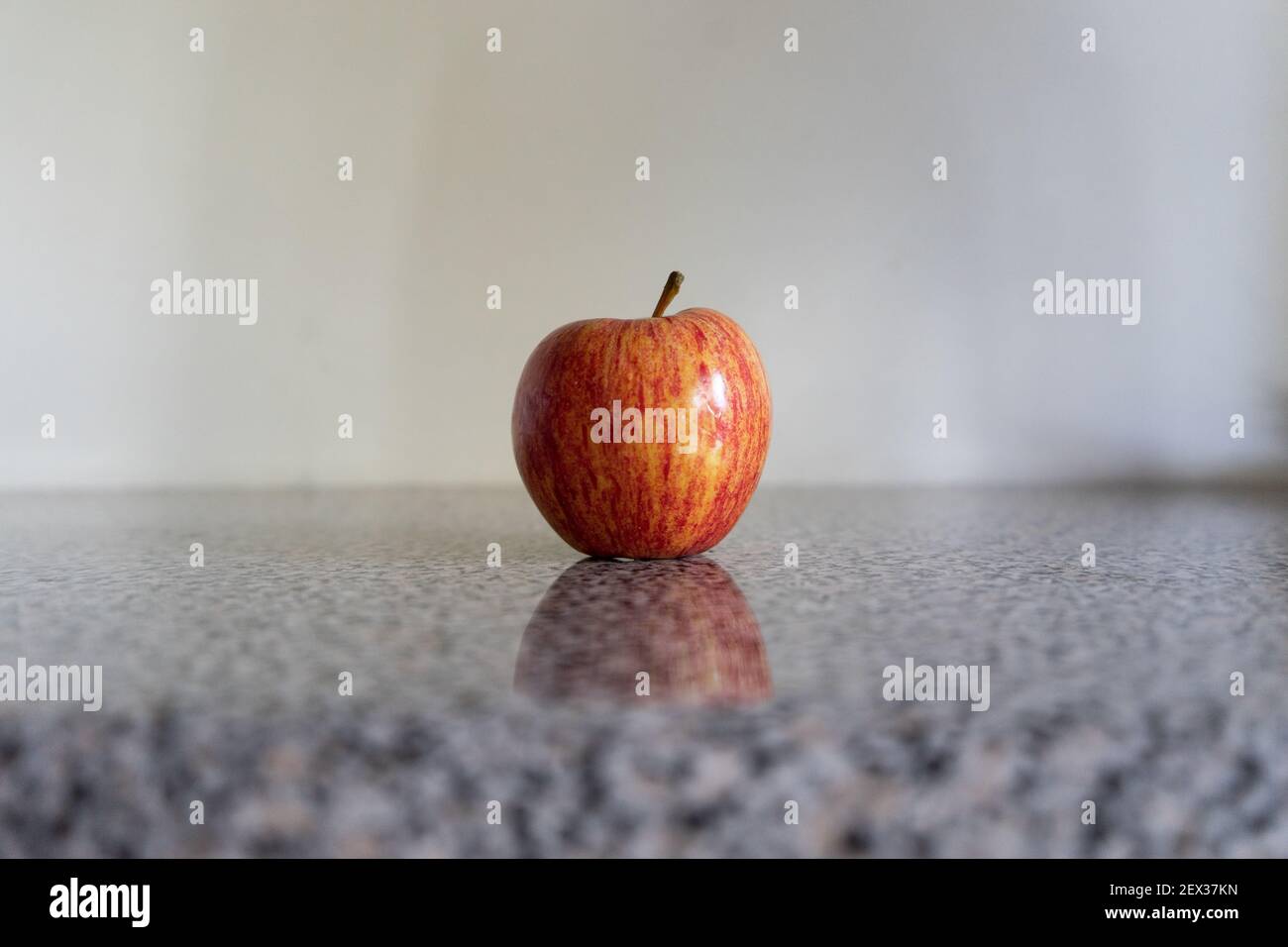 A closeup shot of an apple on the table. Morning vibes Stock Photo - Alamy