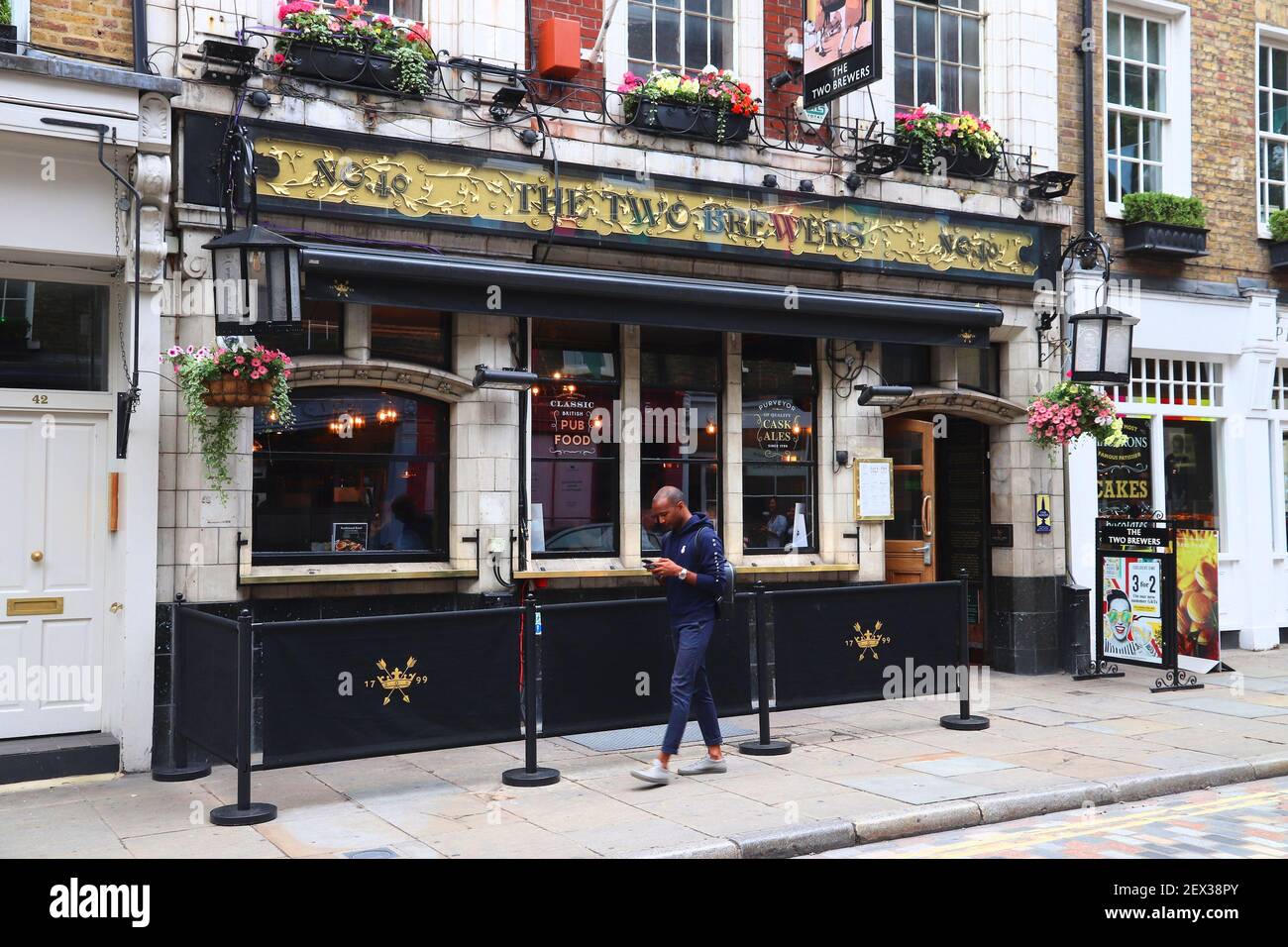 LONDON, UK - JULY 14, 2019: People visit The Two Brewers pub in Soho ...