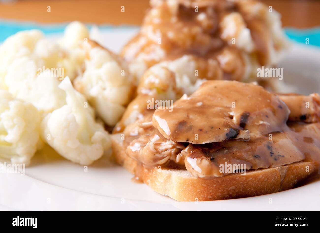 open faced hot chicken sandwich with mased potatoes Stock Photo - Alamy