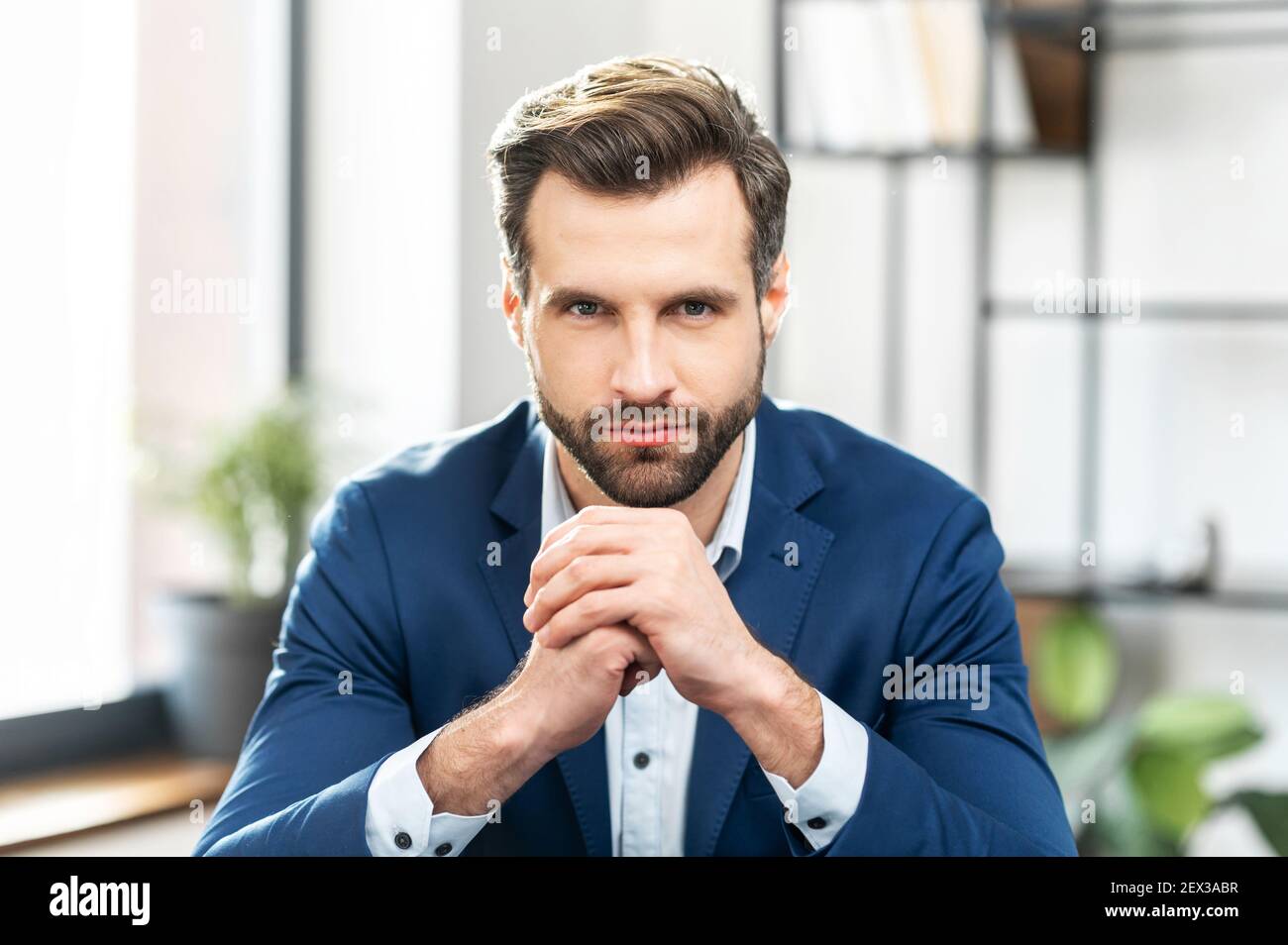 Successful masculine businessman in formal expensive suit, with neat ...