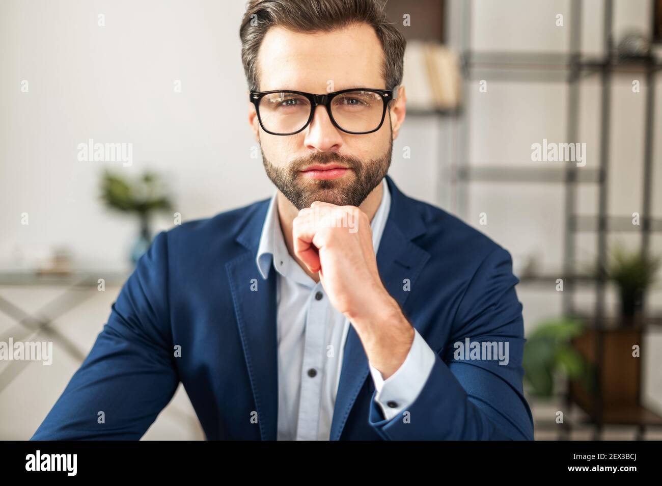 Successful masculine businessman in formal expensive suit, holding arm ...