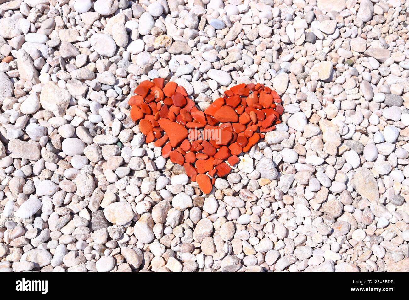 Red heart shape made of beach pebbles. Valentine's Day symbol Stock ...