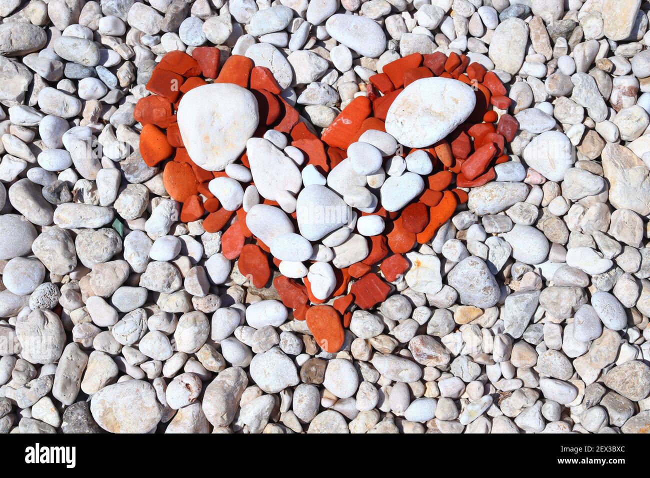 Red heart shape made of beach pebbles. Valentine's Day symbol Stock ...