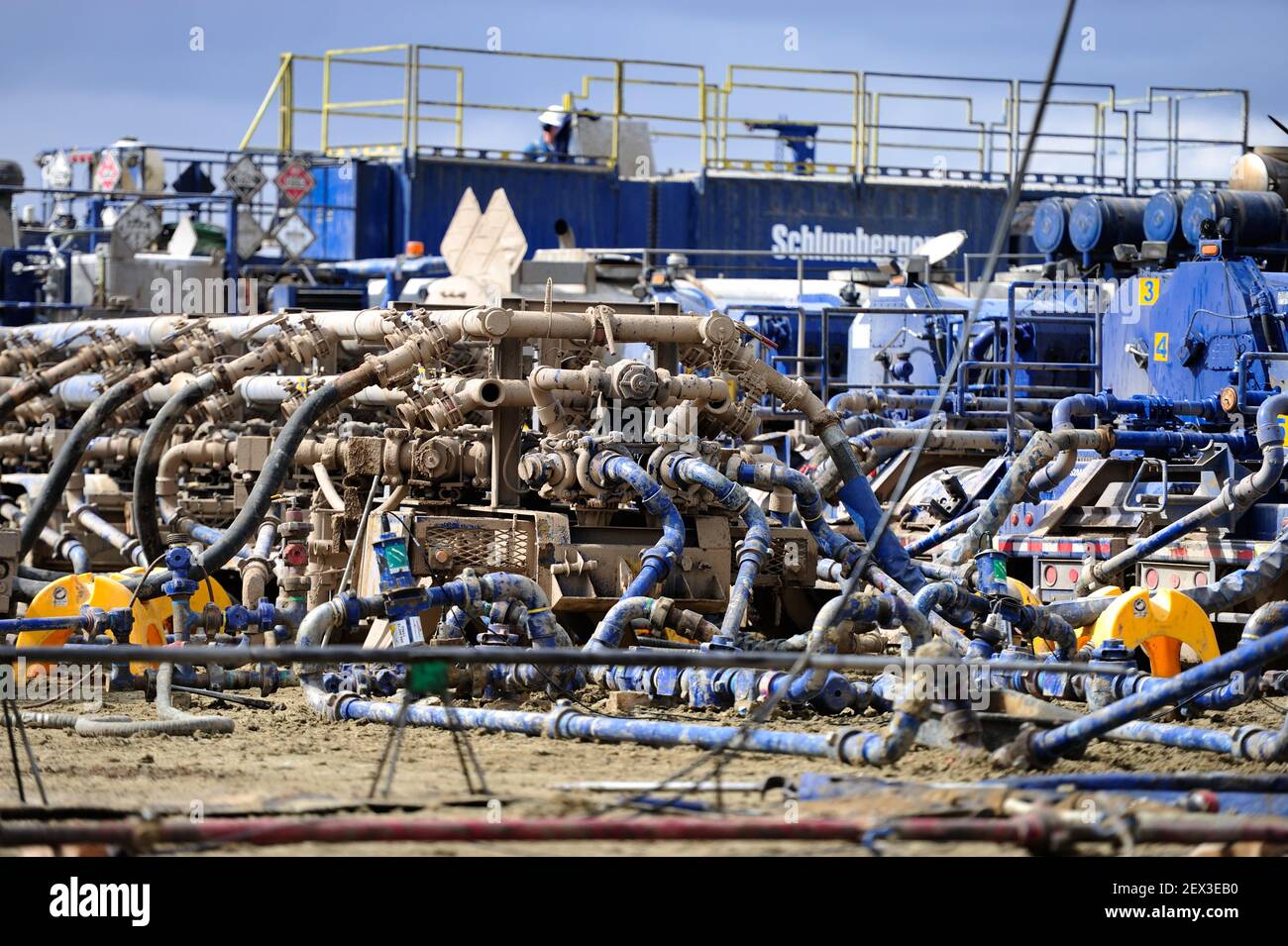 Schlumberger trucks with 2000 horsepower pumps direct water, sand and ...