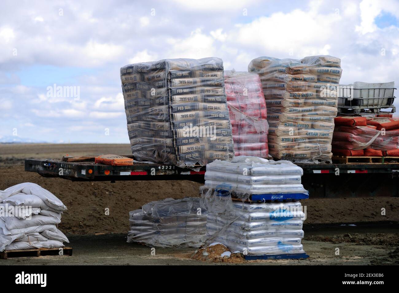 Sand, used in the hydraulic fracking process, sits next to the Ensign ...