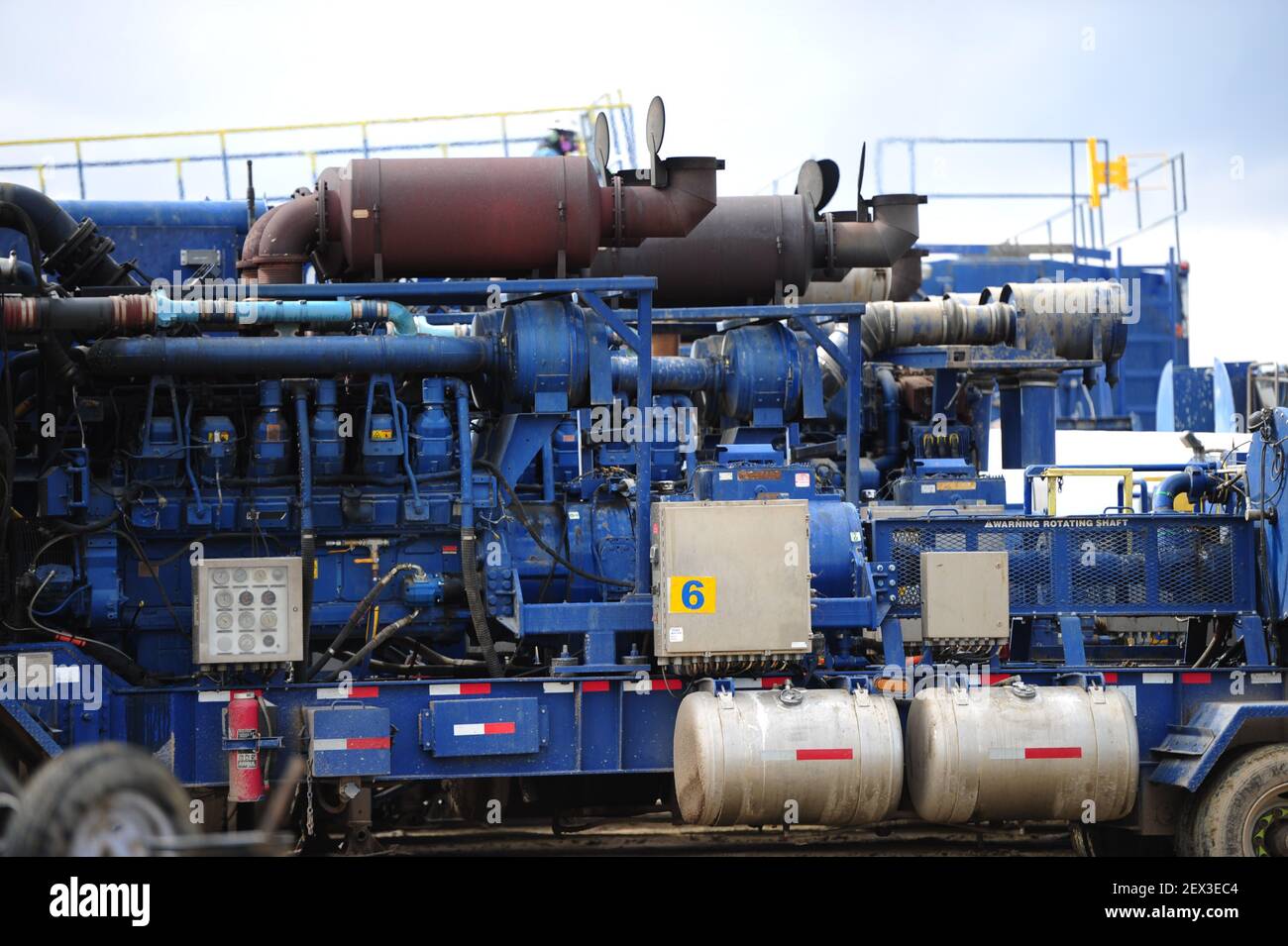 Schlumberger trucks with 2000 horsepower pumps direct water, sand and ...