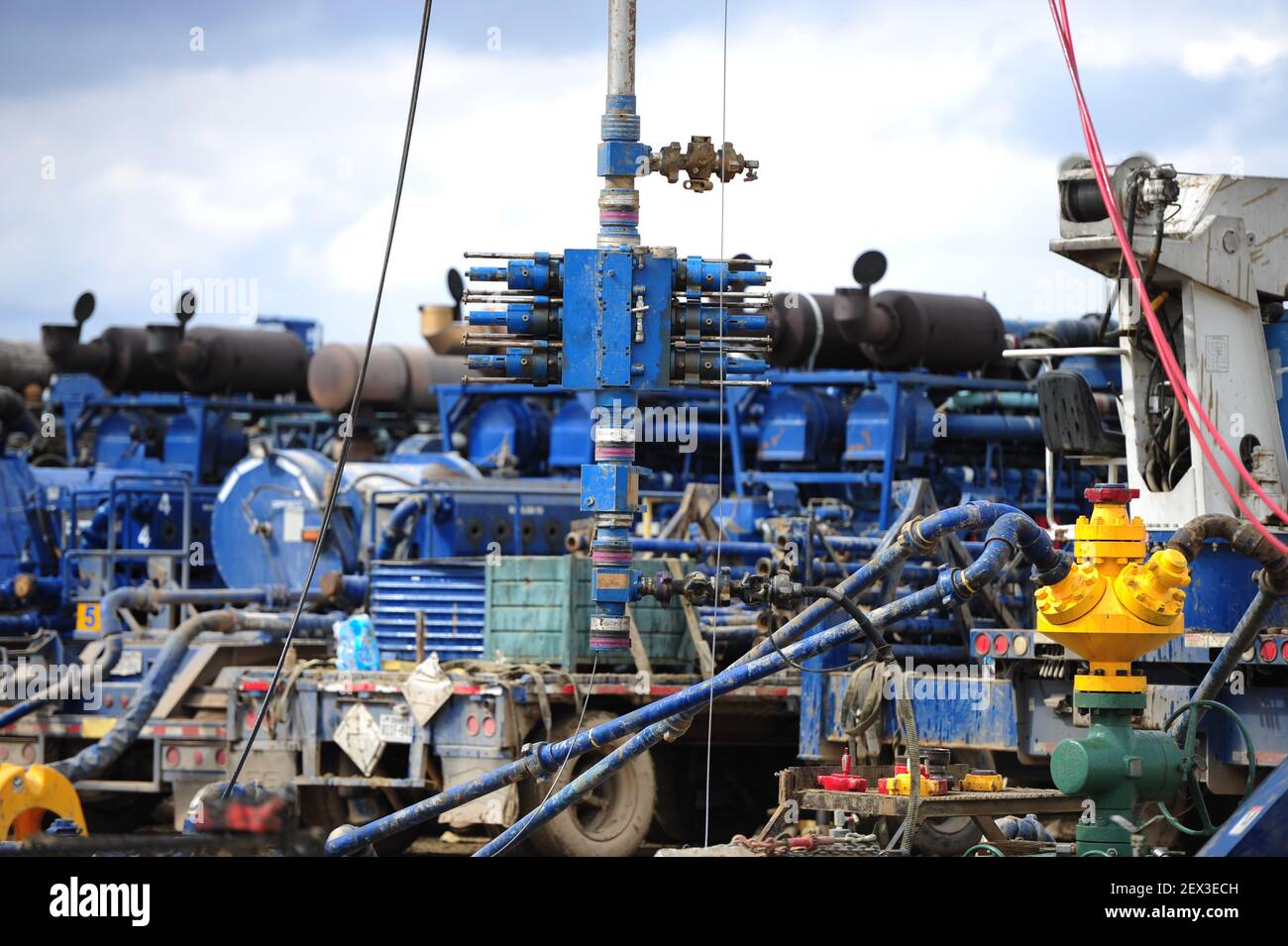 Schlumberger trucks with 2000 horsepower pumps direct water, sand and ...