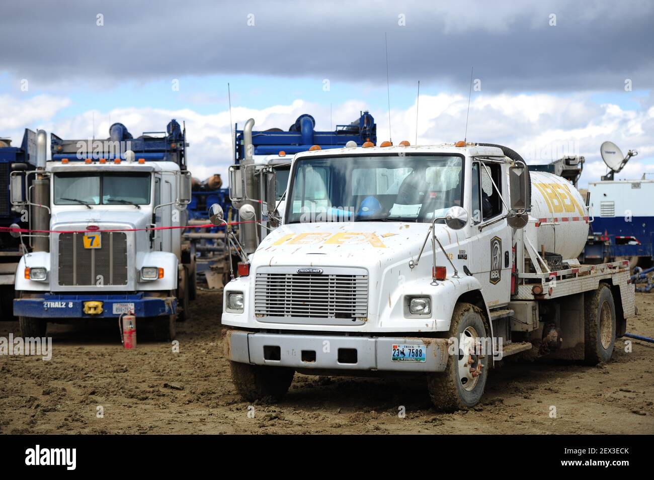 Schlumberger trucks with 2000 horsepower pumps direct water, sand and ...