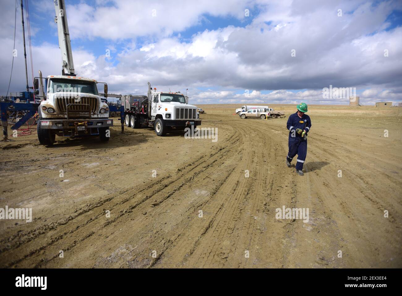 Schlumberger trucks with 2000 horsepower pumps direct water, sand and ...
