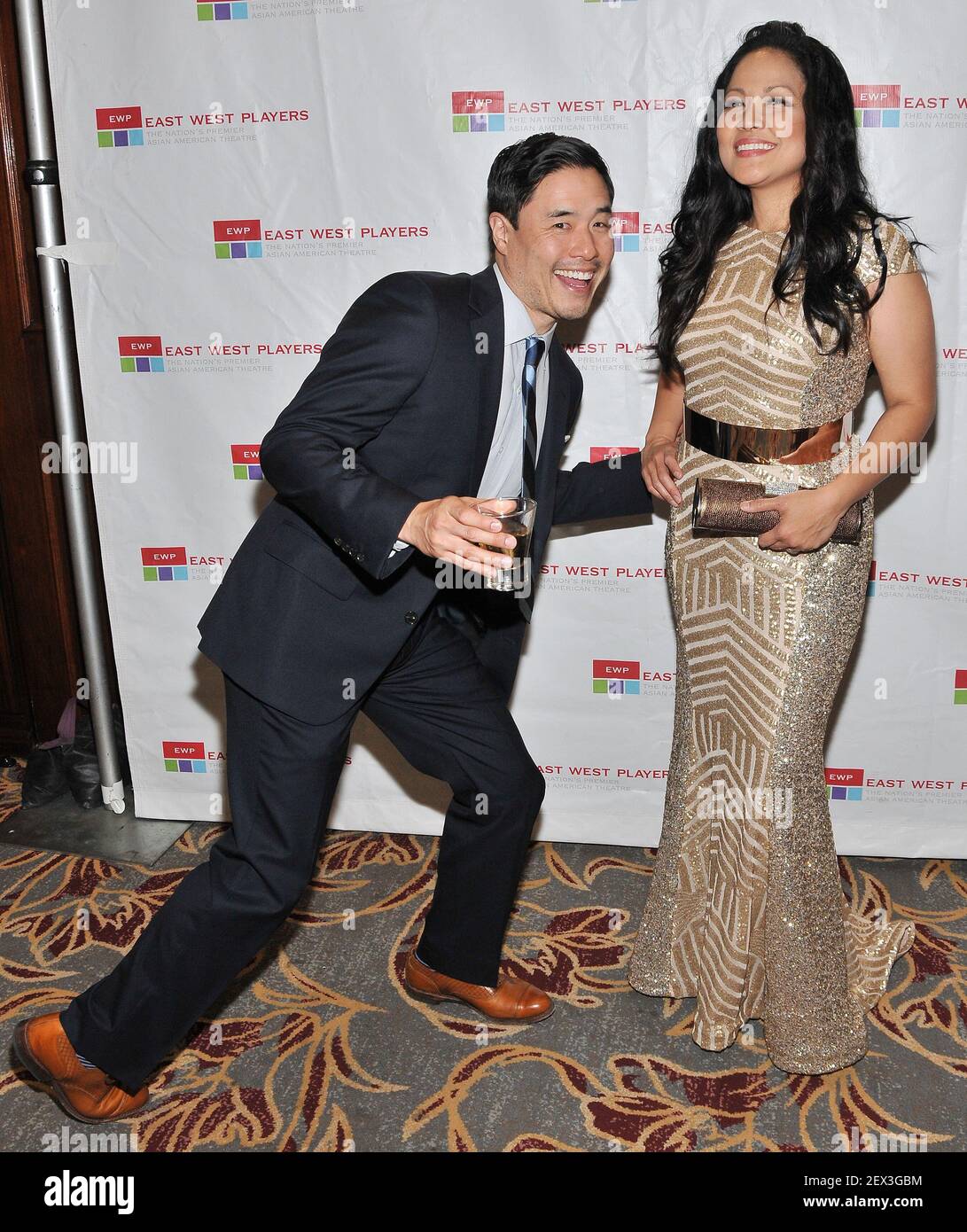 (L-R) Randall Park into the photo with Joan Almedilla backstage at the East West Players' Golden ...