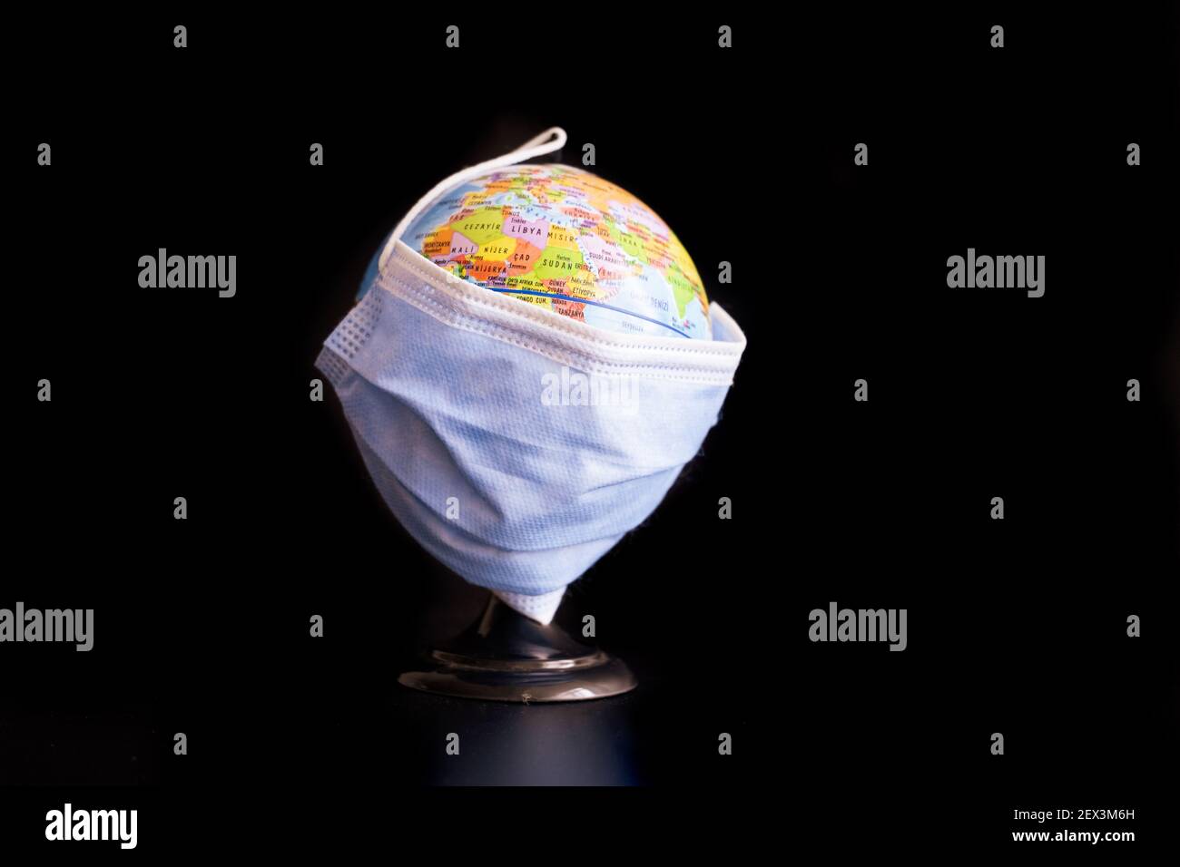 Covid mask covers around all over the world. Metaphor and allegory ...