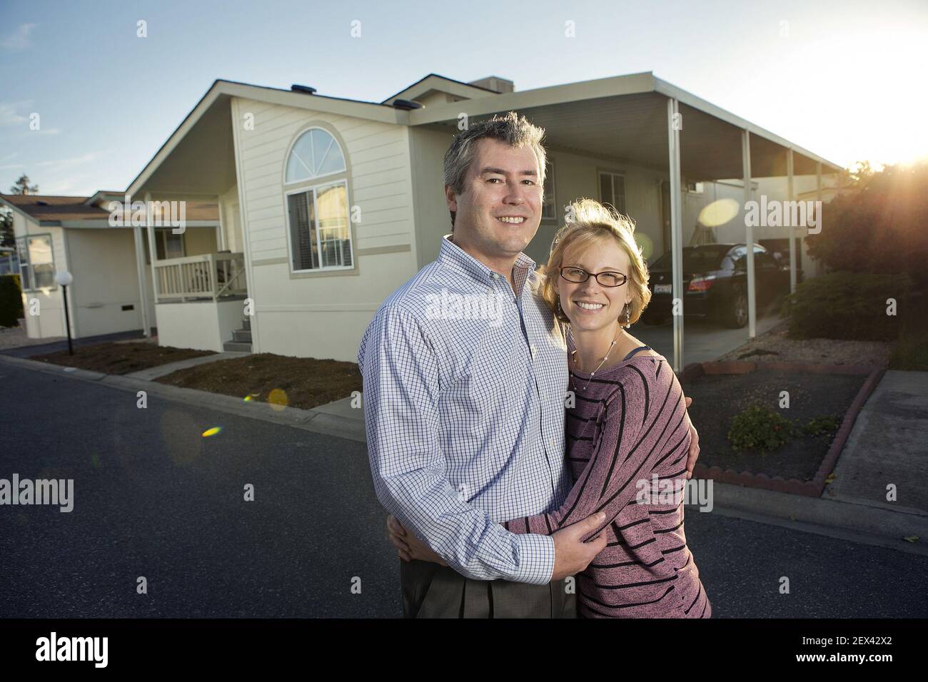 Rod Fox, left, and his wife Emily Gwynn pose for a portrait in front of ...