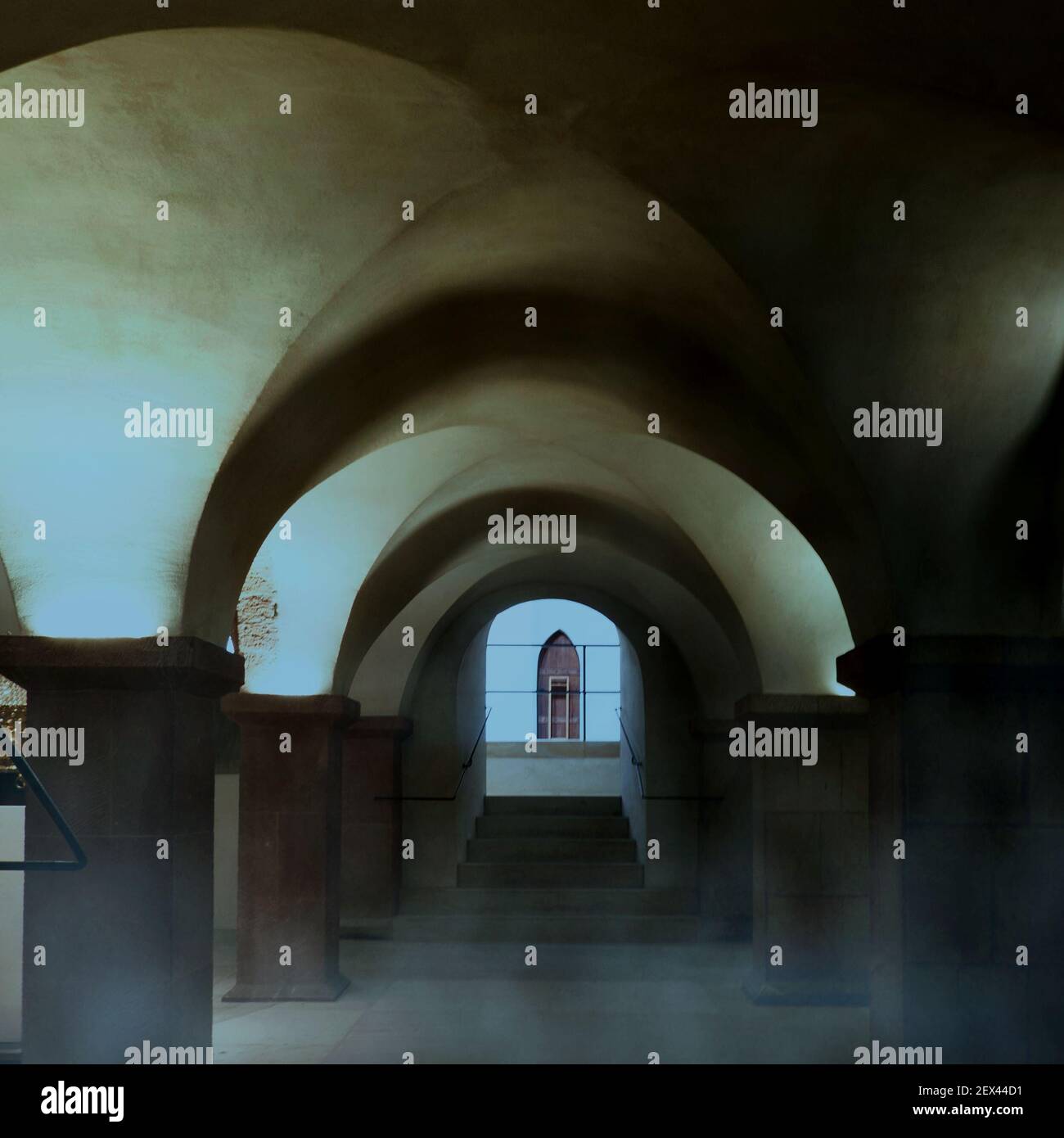 Columns and arches in the hazy foggy antechamber of the entrance to a ...