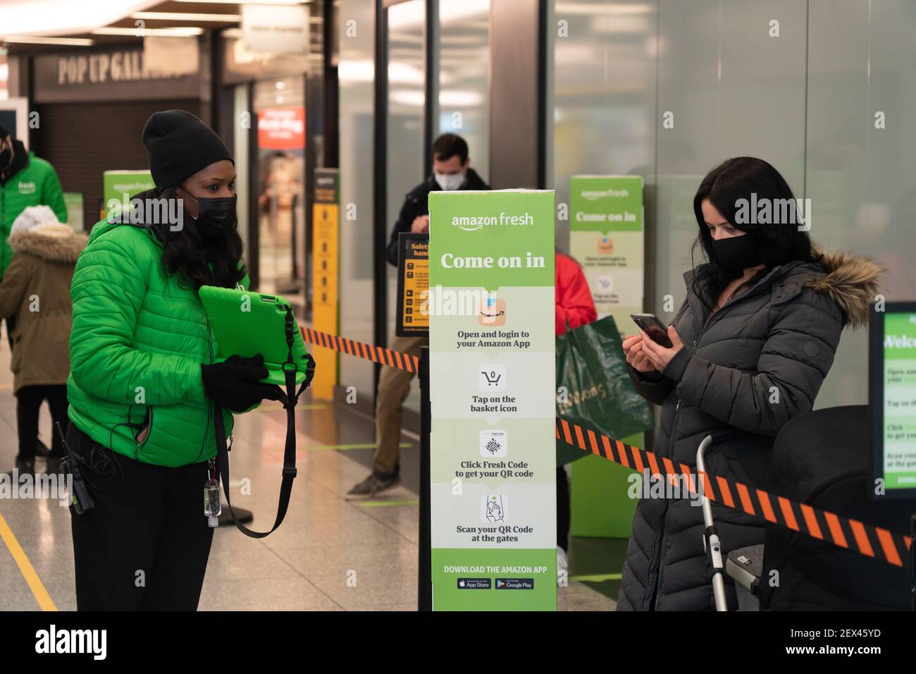 London, UK. 4th March, 2021. Shoppers at the new Amazon Fresh store ...