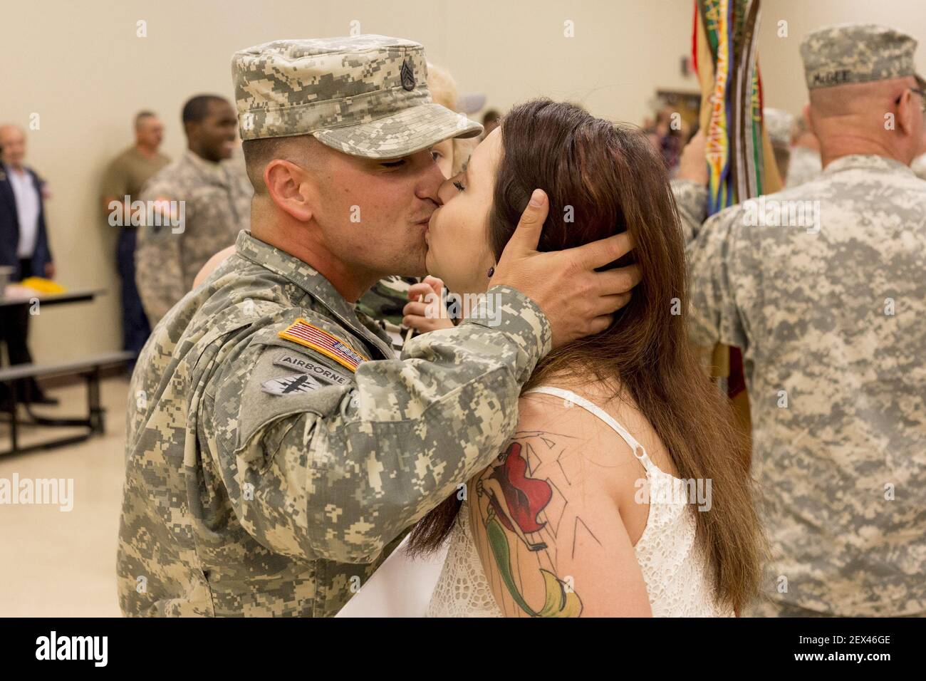 Sgt. Daniel Slaughter, left, pulls in his girl friend Shadi Huffaker for kiss on Saturday, May 2 ...