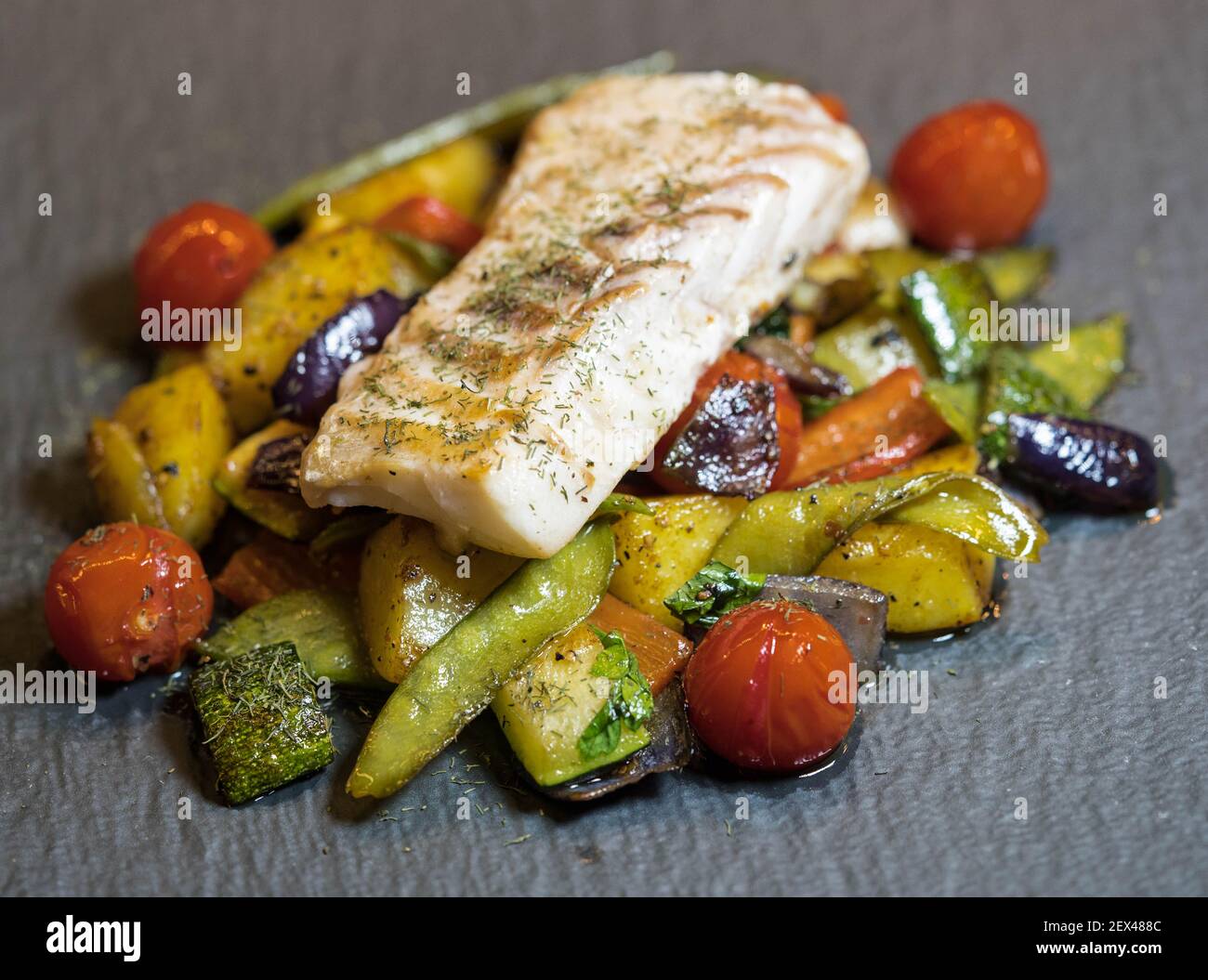 roasted cod fillet on mediterranean vegetables Stock Photo - Alamy