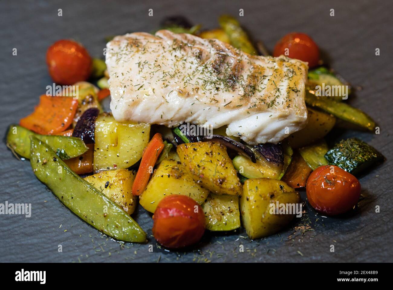 roasted cod fillet on mediterranean vegetables Stock Photo - Alamy