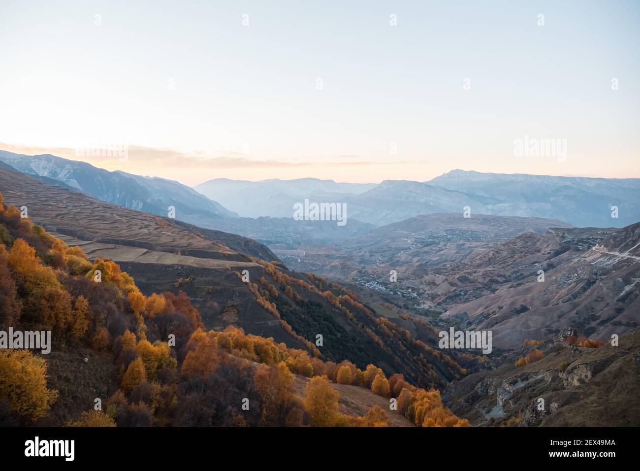 Wonderful large valley with ancient mountains covered with autumn ...