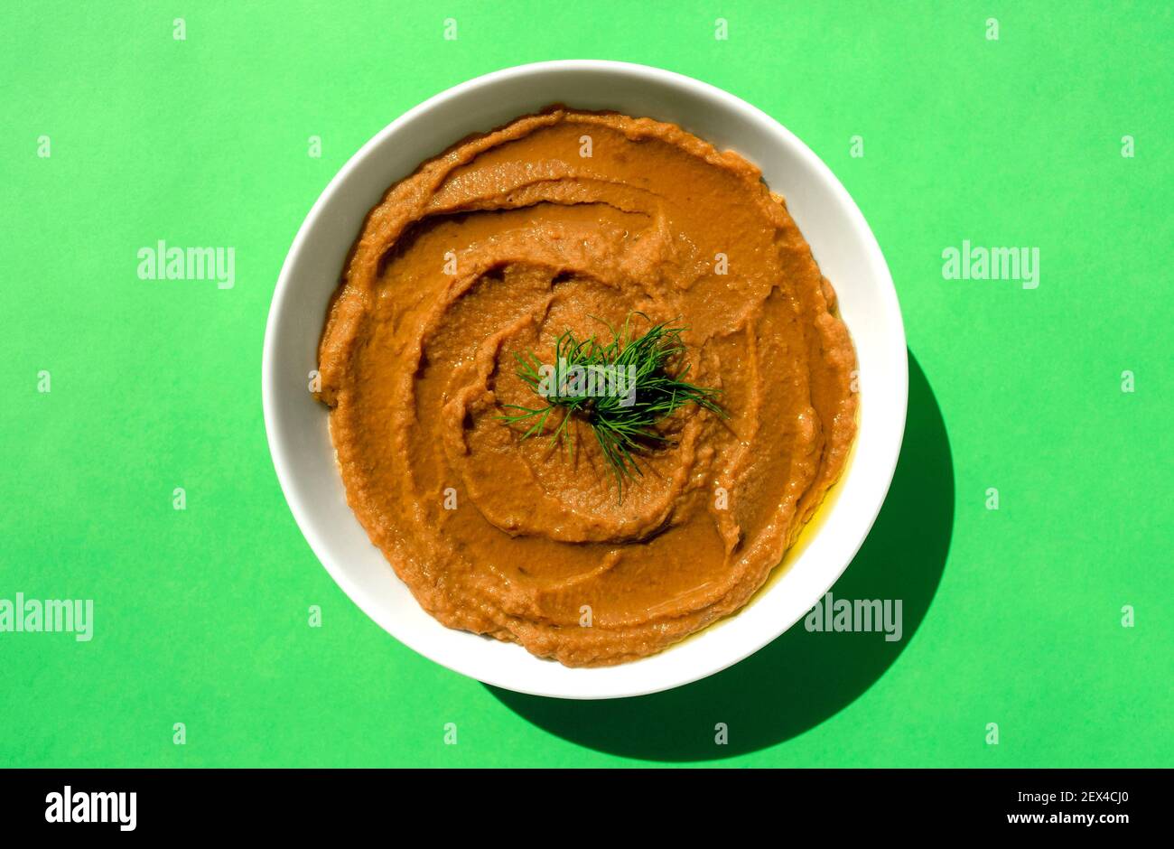 Arabic cuisine - peeled fava beans mashed plain in white bowl on green ...