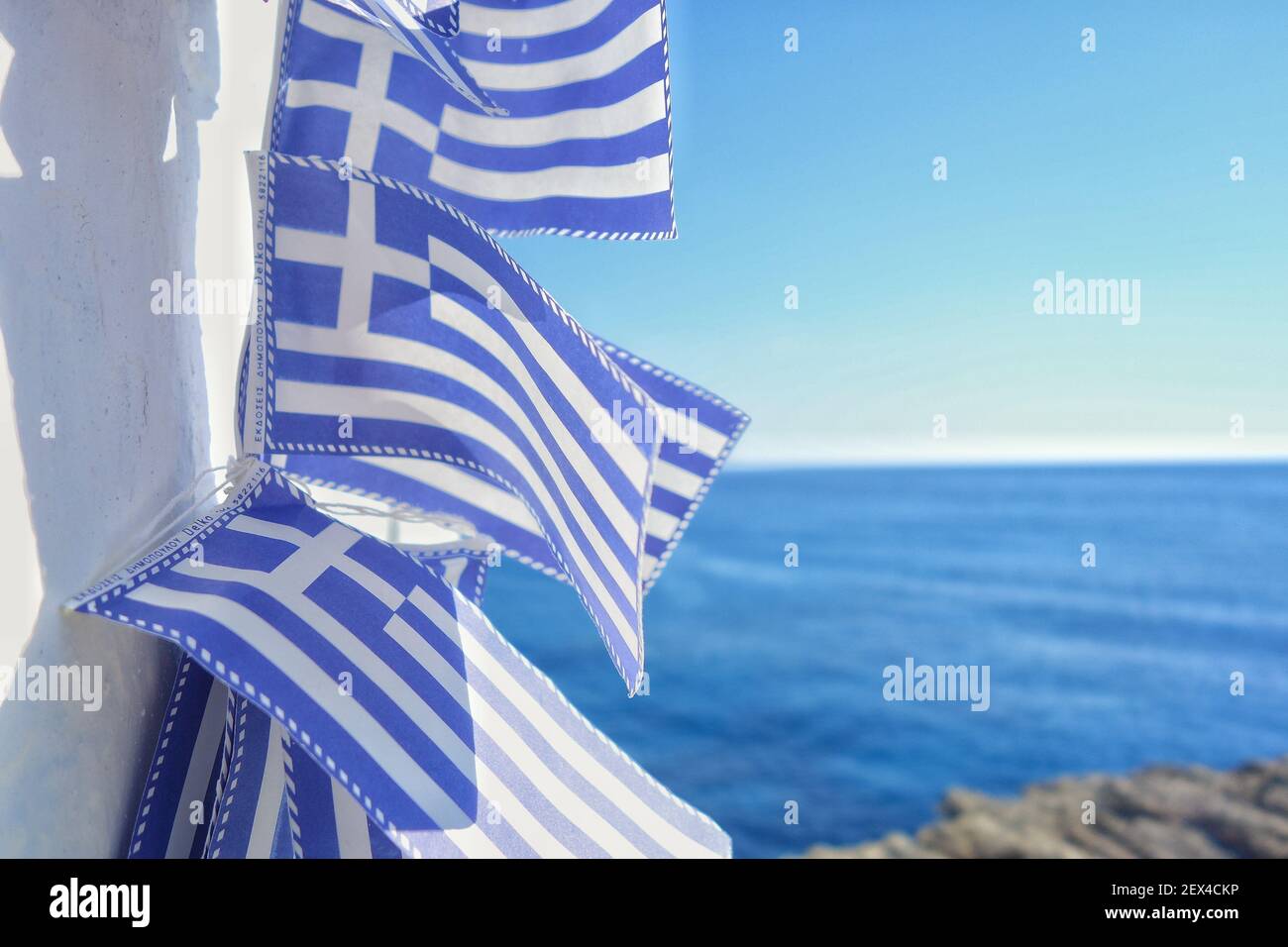 Greek flags hanging on a wall on the island of Folegandros Stock Photo ...