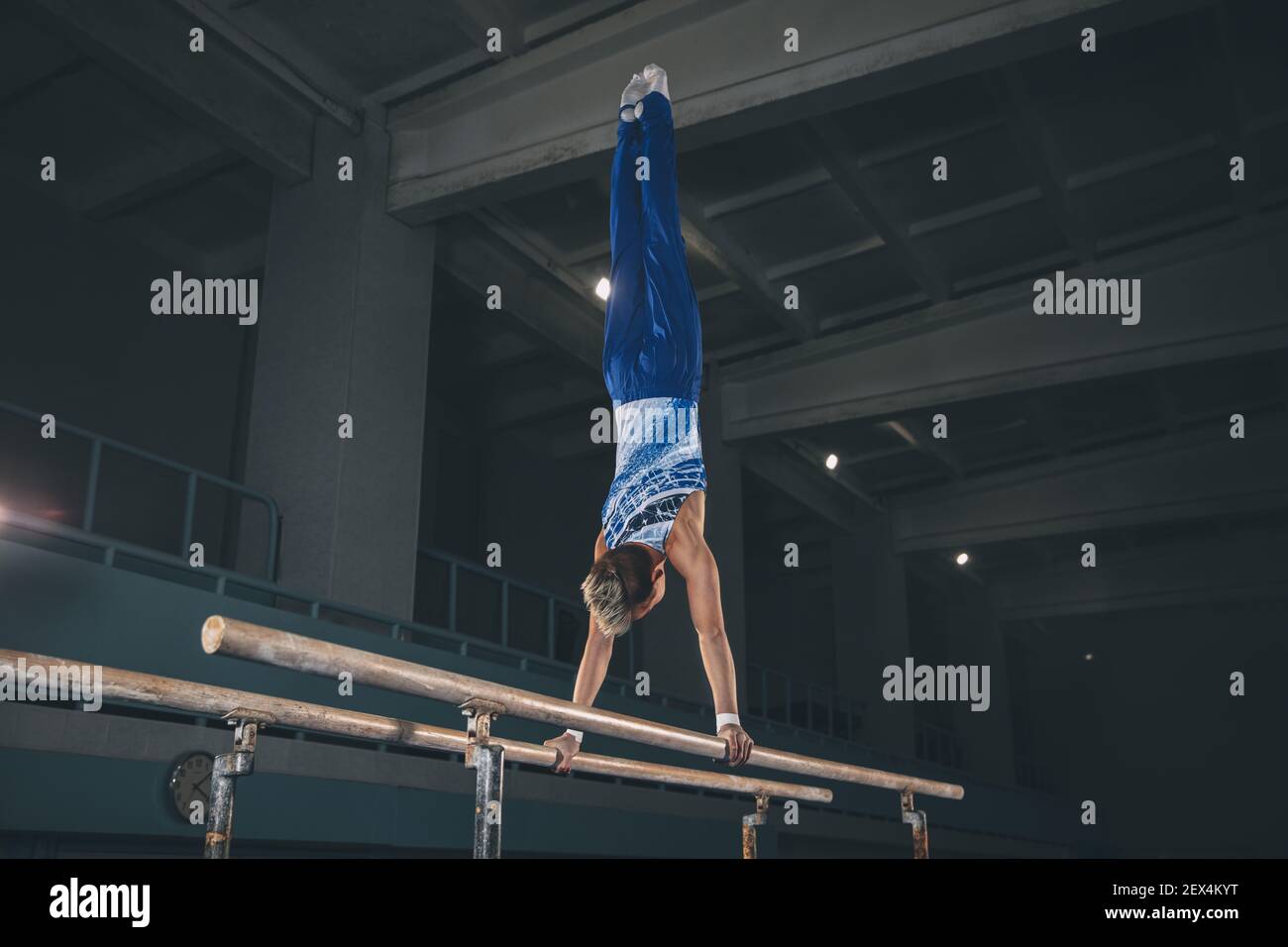 Energy. Little male gymnast training in gym, composed and active ...