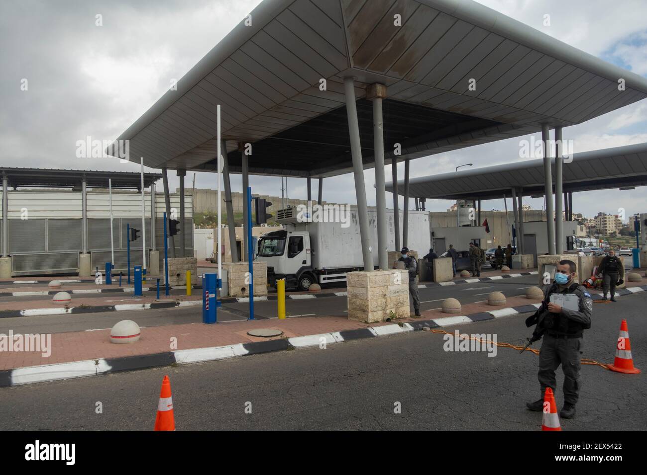 Israeli cars driving through Hizma or Hizmeh checkpoint a passageway on ...