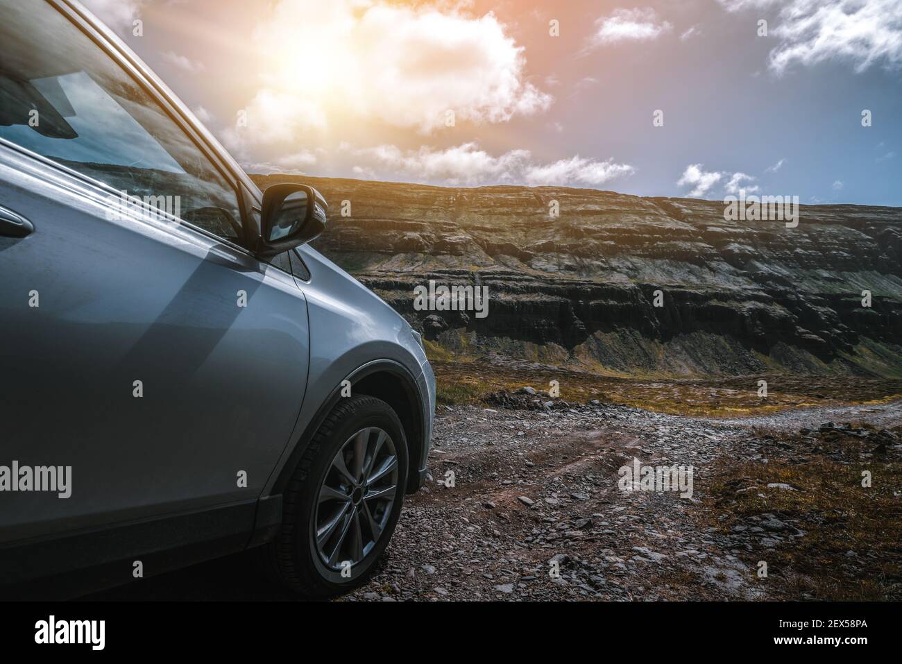 4WD SUV vehicle car running on gravel road with nature mountain ...