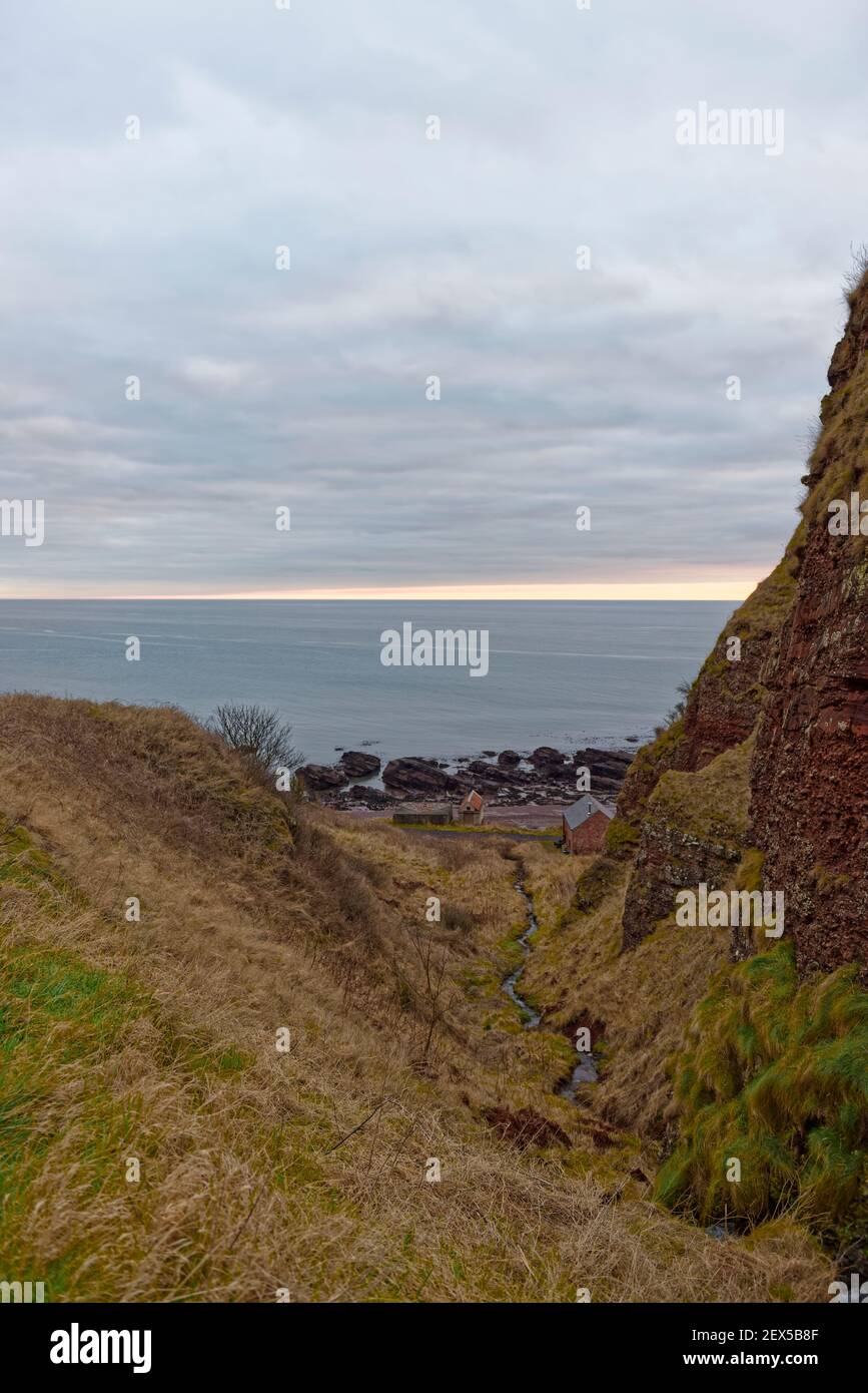 The Abandoned Fishing Buildings at Auchmithie Beach seen from the Cliff ...