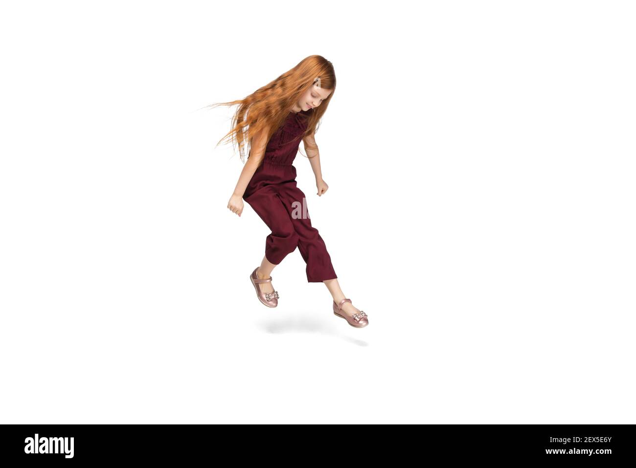 Jumping, flying. Happy, smiley little caucasian girl isolated on white ...