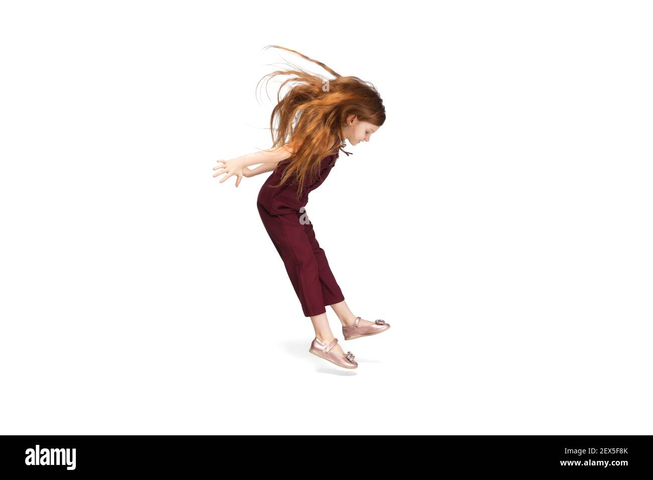 Jumping, flying. Happy, smiley little caucasian girl isolated on white ...