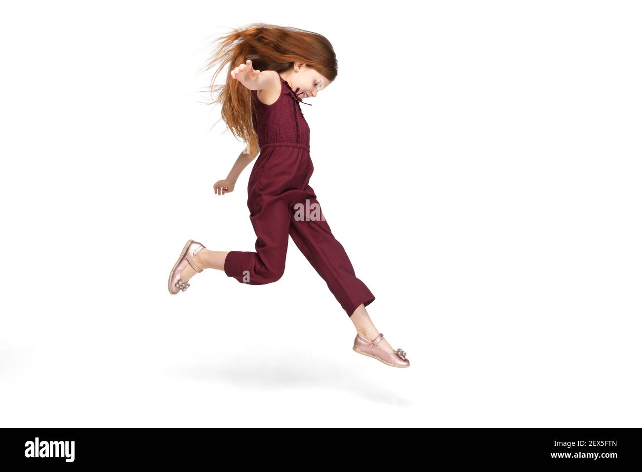 Jumping, flying. Happy, smiley little caucasian girl isolated on white ...