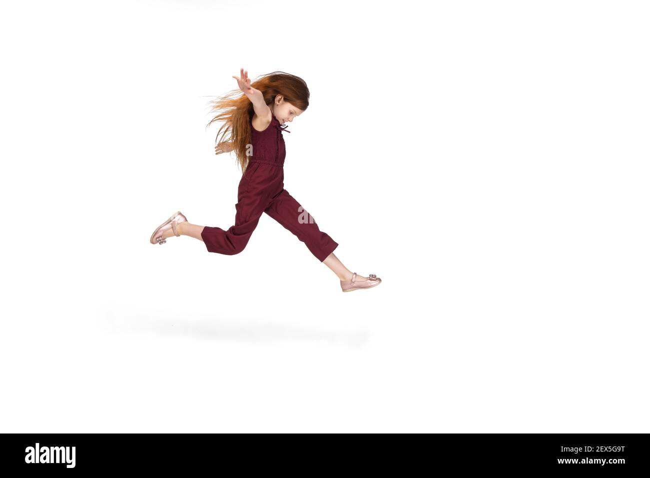 Jumping, flying. Happy, smiley little caucasian girl isolated on white ...