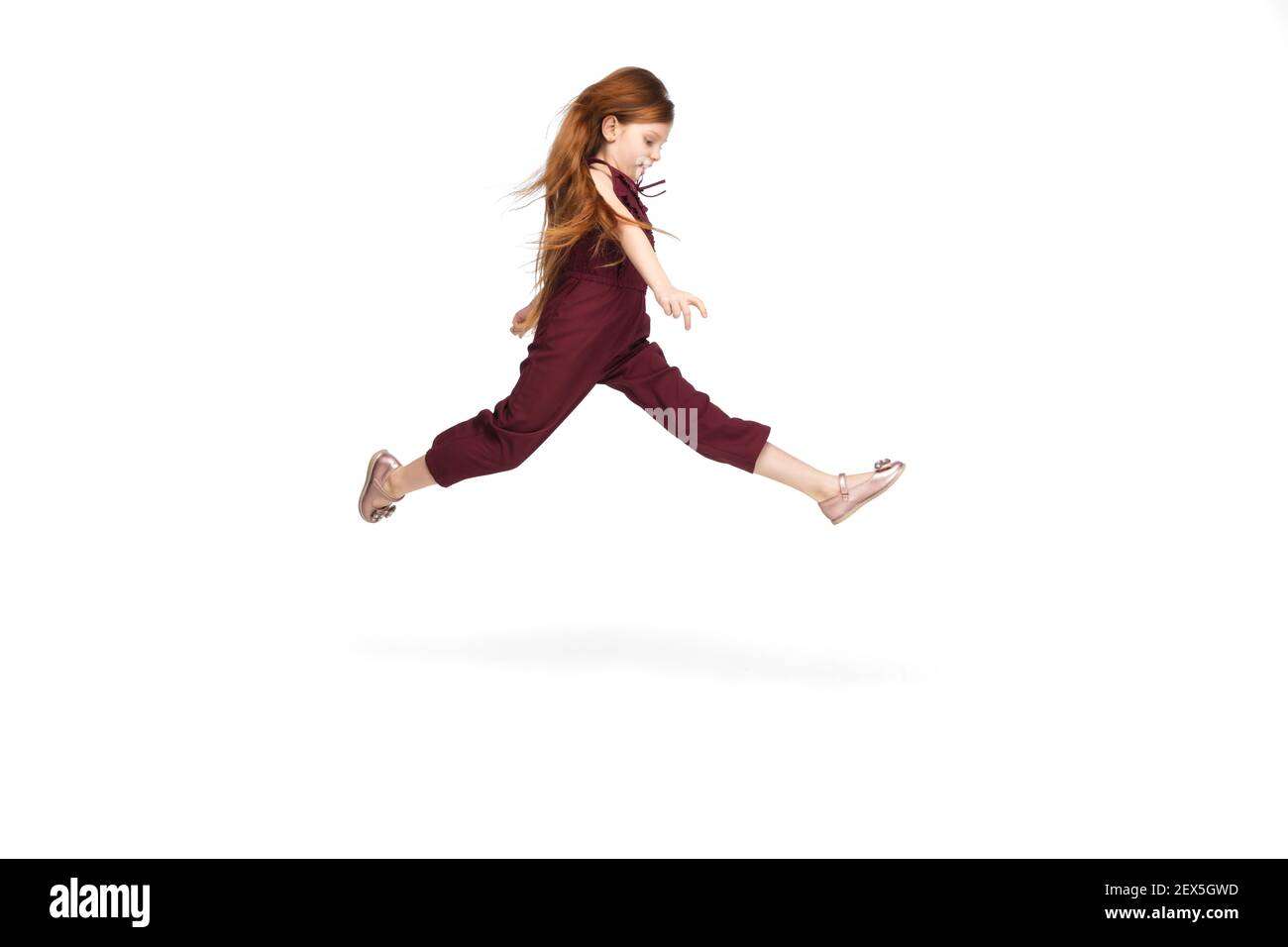 Jumping, flying. Happy, smiley little caucasian girl isolated on white ...