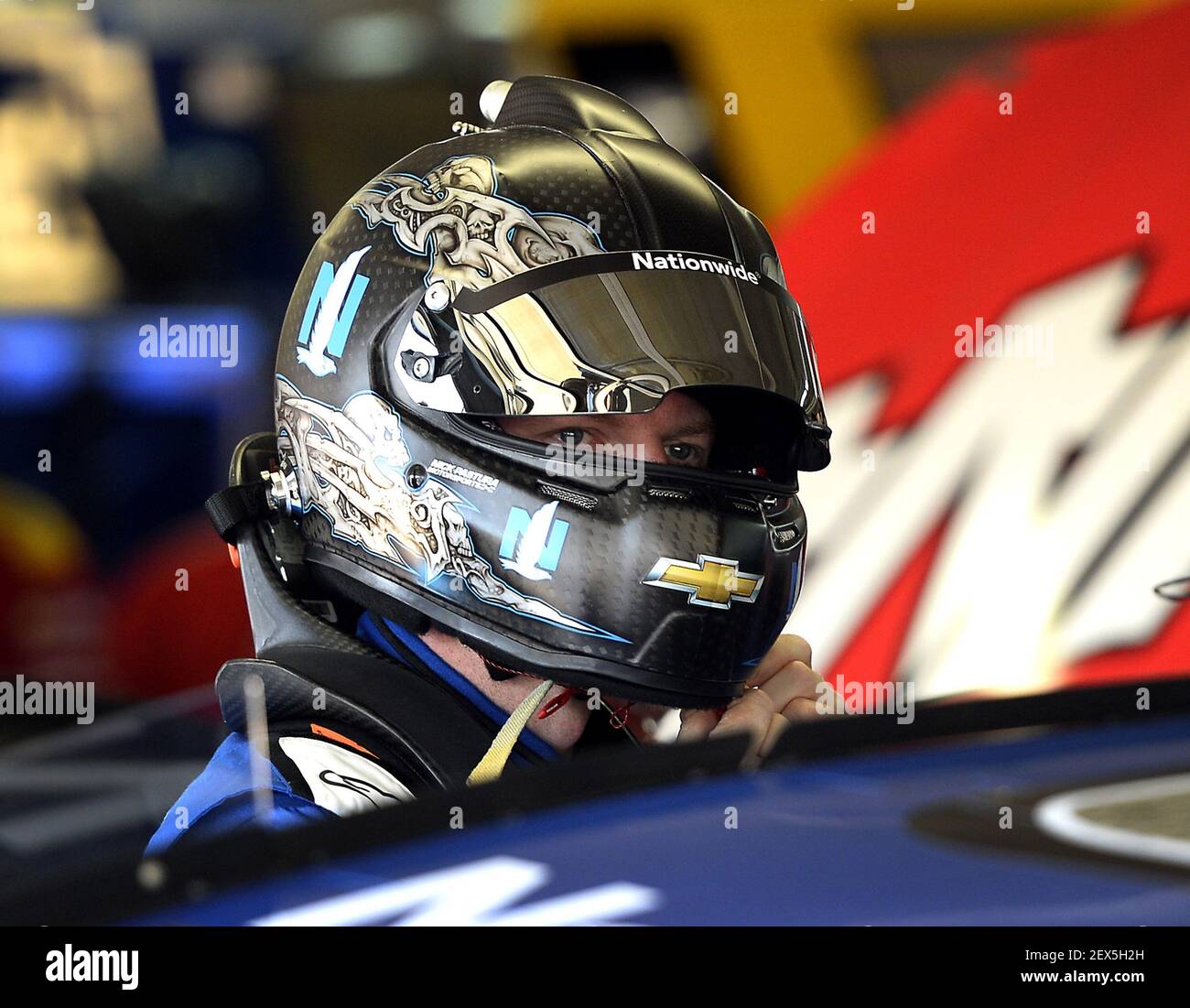 NASCAR Sprint Cup Series driver Dale Earnhardt Jr., tightens the strap ...