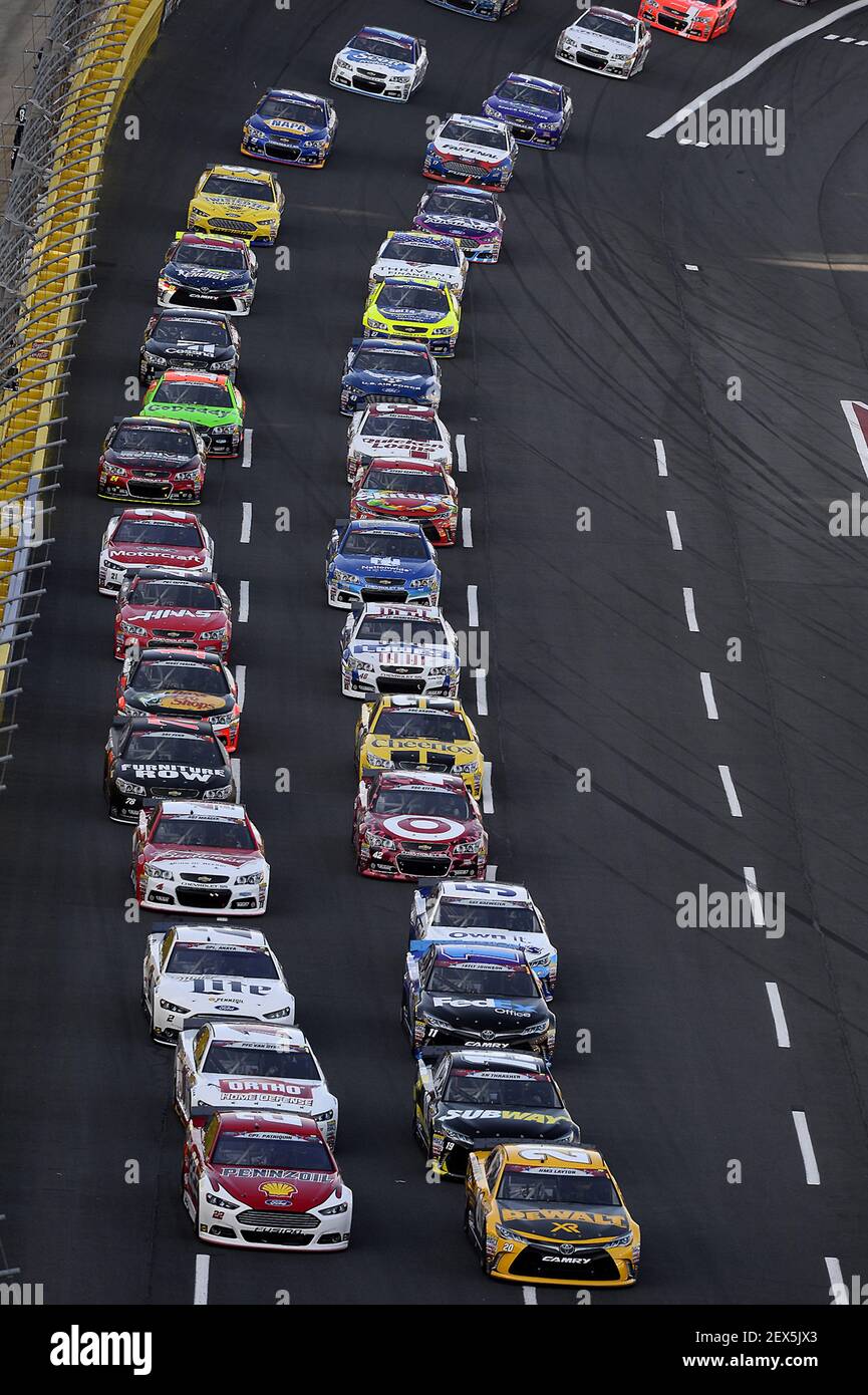 The field in the Coca-Cola 600 approach the start/finish line at ...