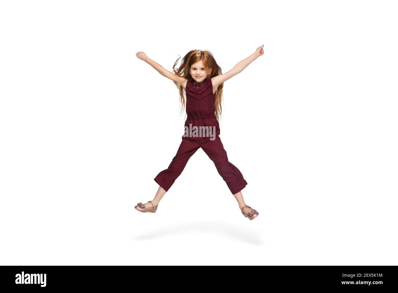 Jumping, running. Happy, smiley little caucasian girl isolated on white ...