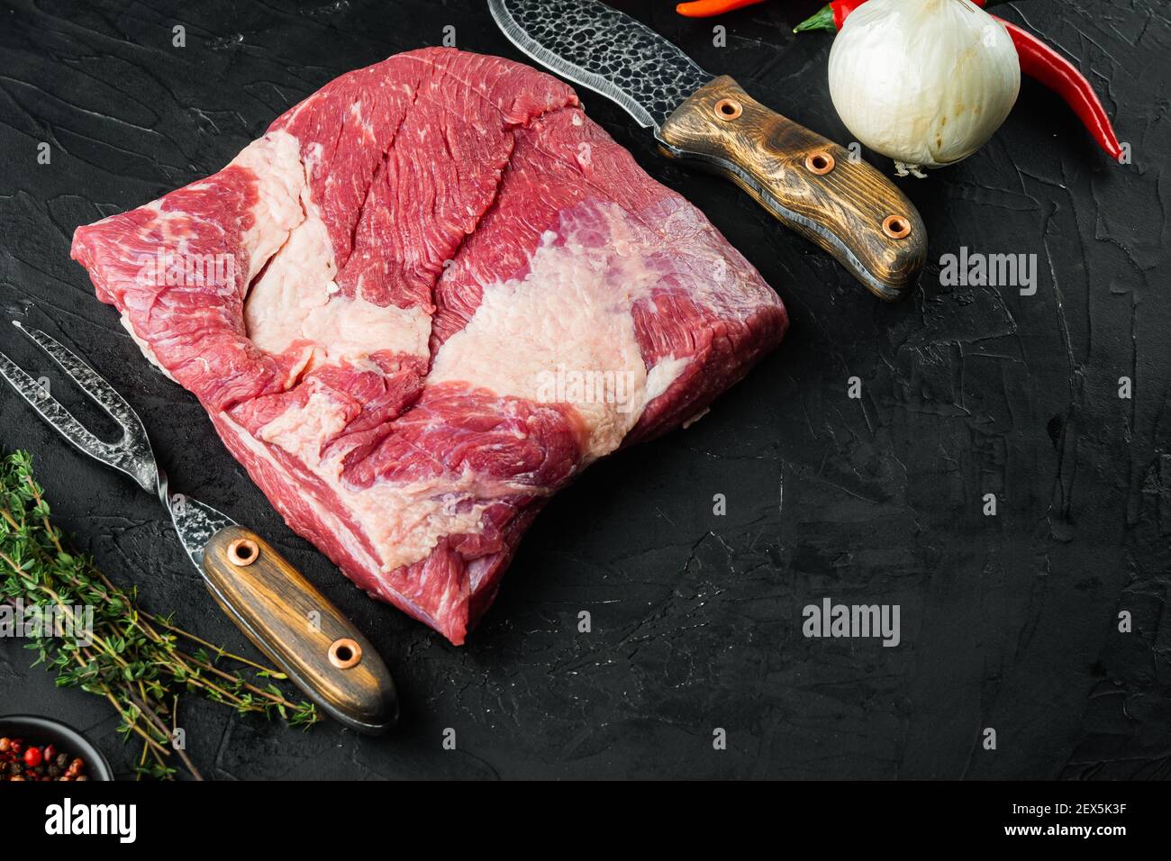 Fresh uncooked raw meat beef brisket set,with ingredients for smoking ...