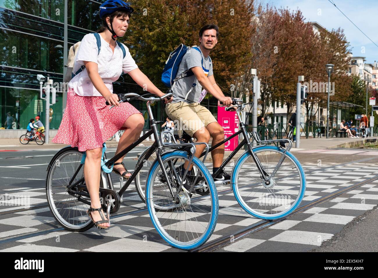 Car passing by woman hi-res stock photography and images - Alamy