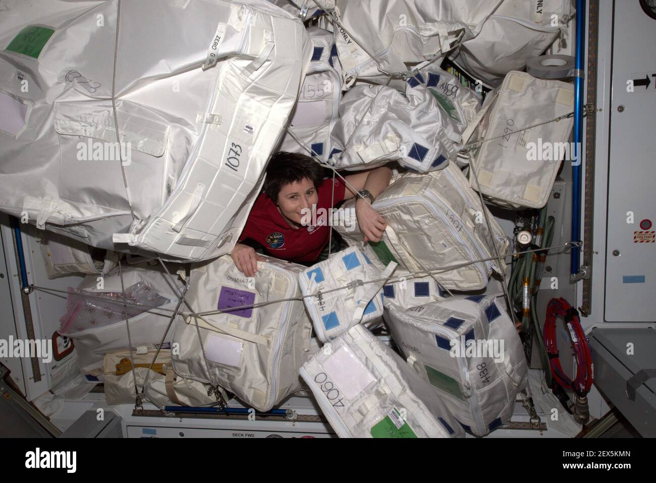 ESA astronaut Samantha Cristoforetti packing cargo for the the Dragon ...