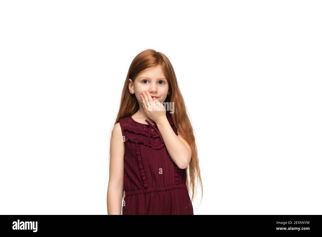 Shy, cute. Happy, smiley little caucasian girl isolated on white studio ...