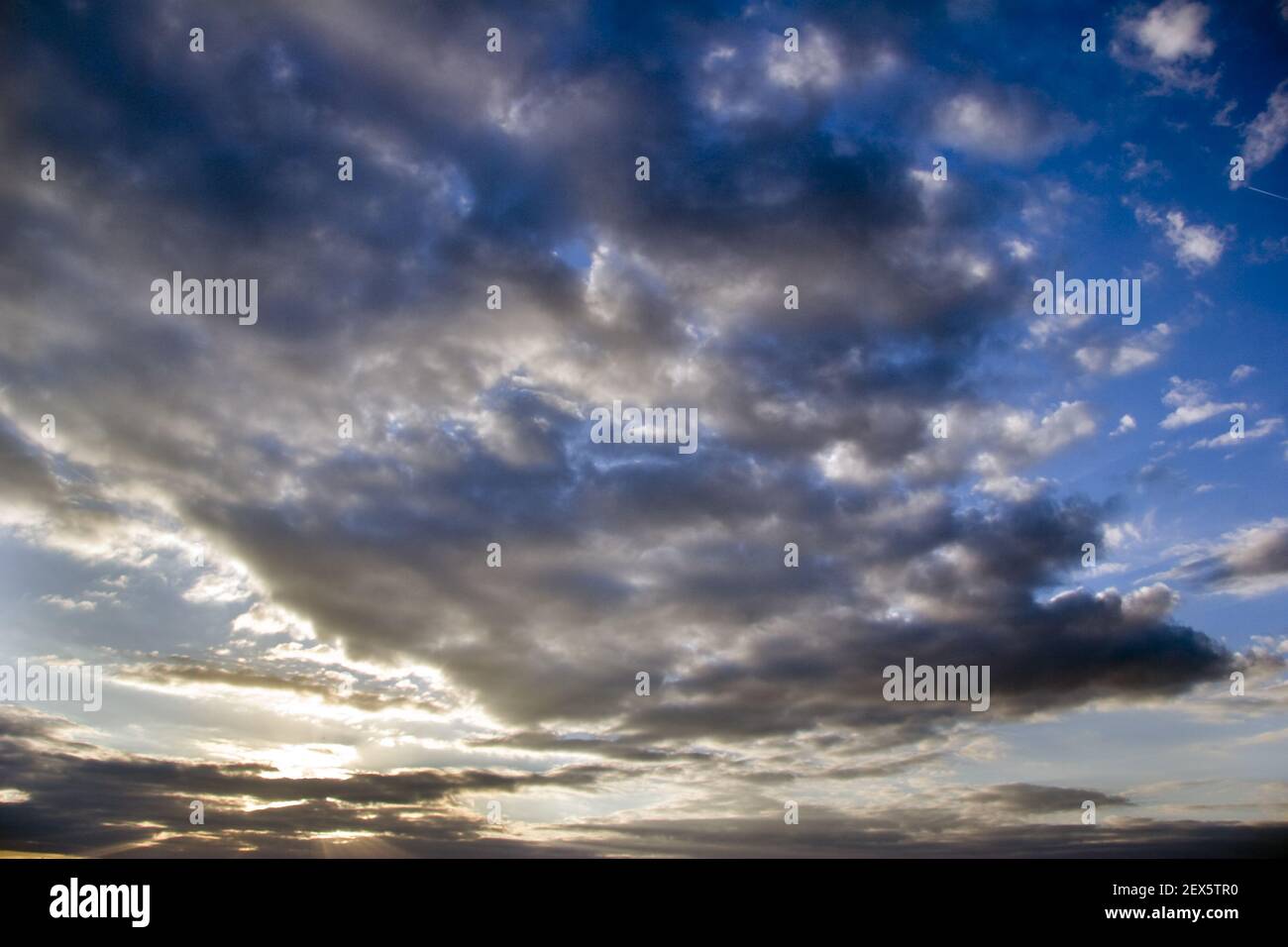 Sunset with dark clouds Stock Photo - Alamy