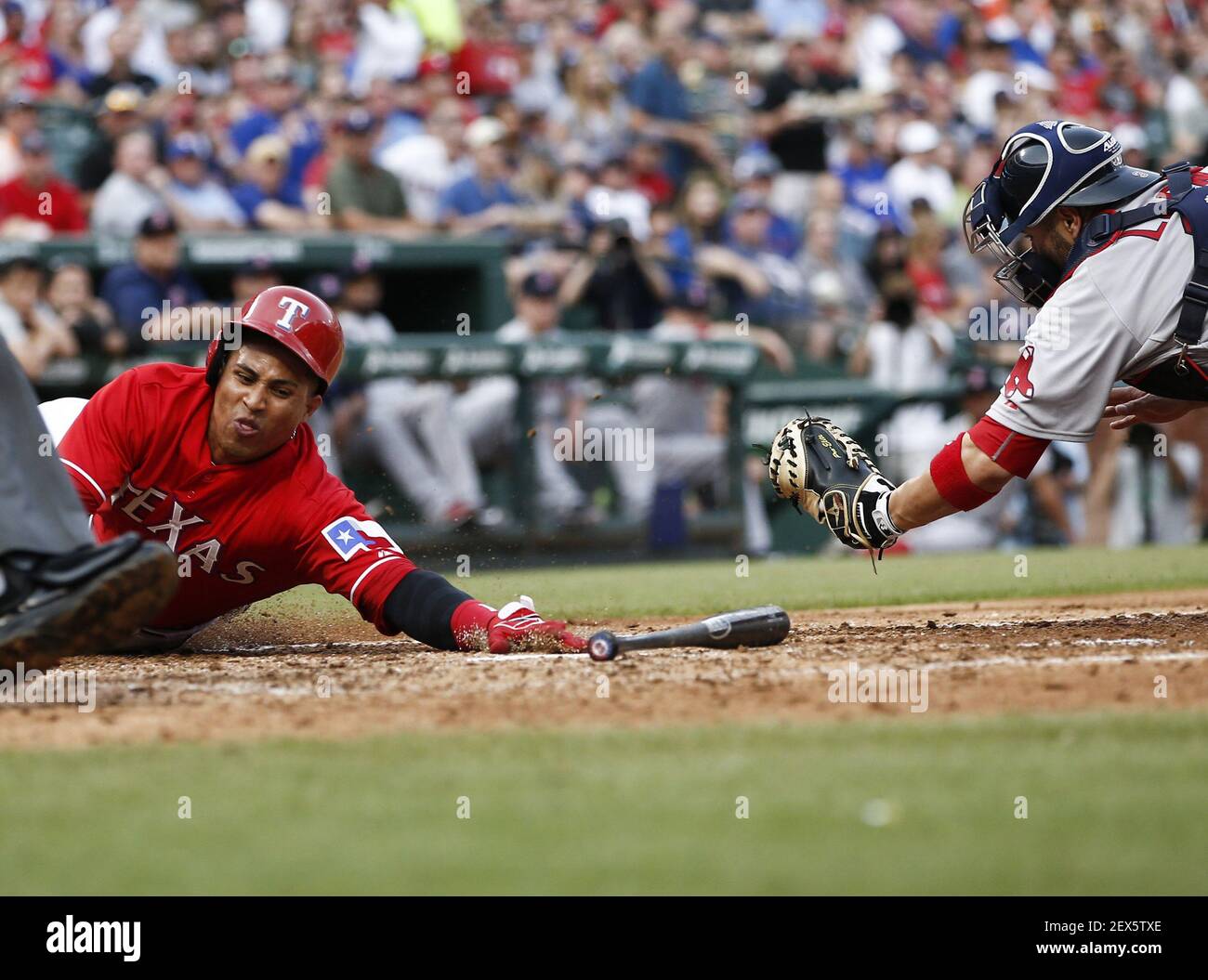 The Texas Rangers' Leonys Martin, left, slides safely home ahead of the ...