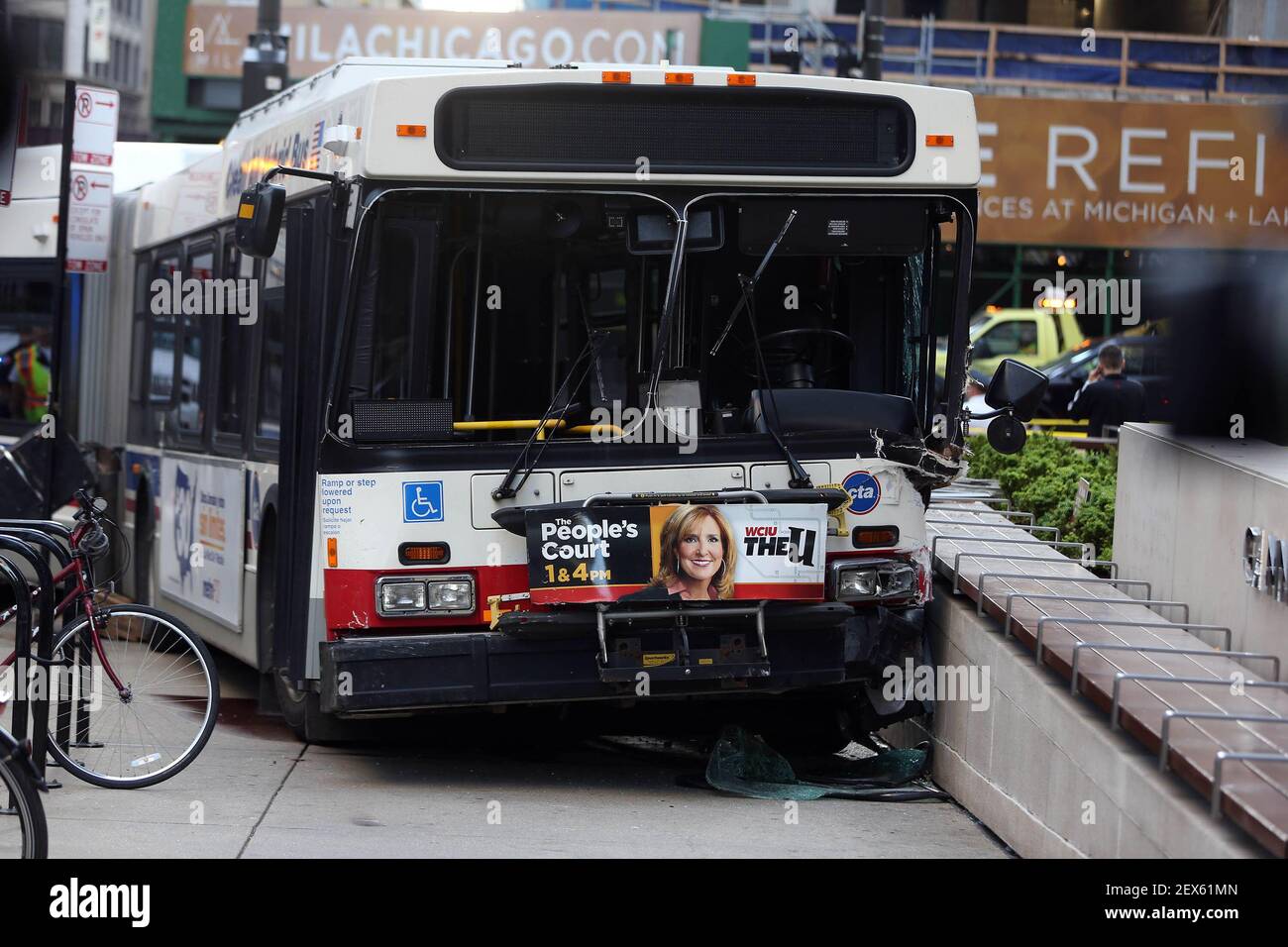 A CTA bus, in a multi-vehicle crash, jumps the curb at Lake Street and ...