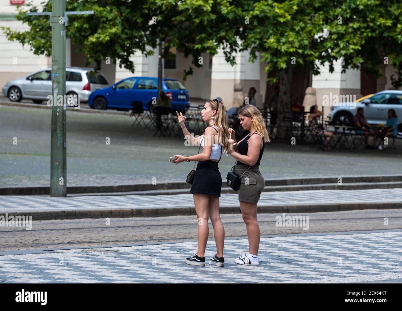 Prague - Czech Republic - 08 01 2020: Two attractive girls waiting for ...