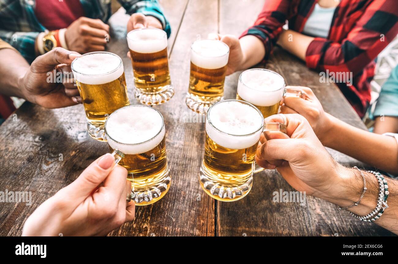Friends hands toasting beer pints at brewery pub restaurant - Beverage ...