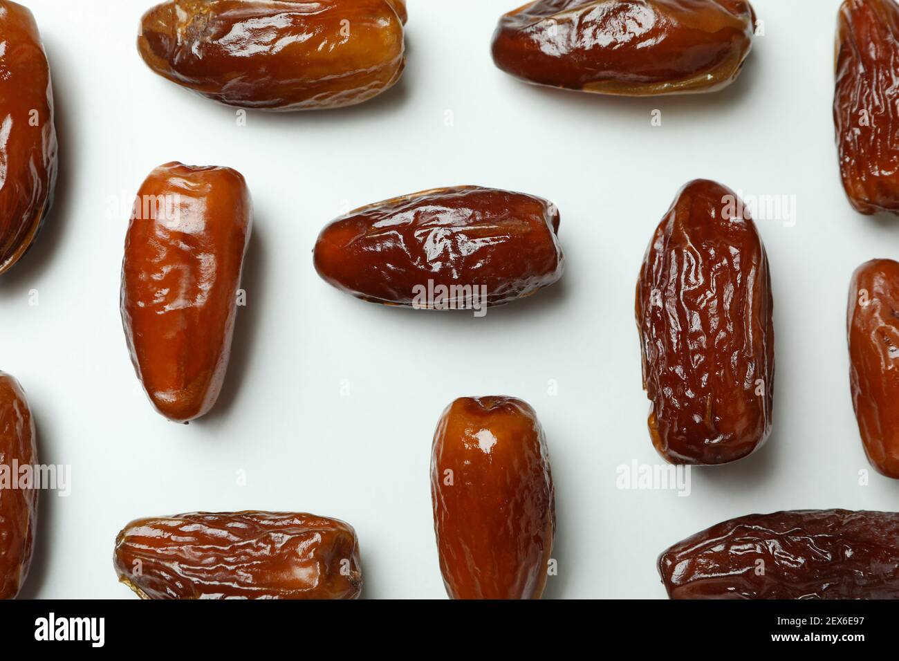 Flat lay with tasty dates on white background Stock Photo - Alamy